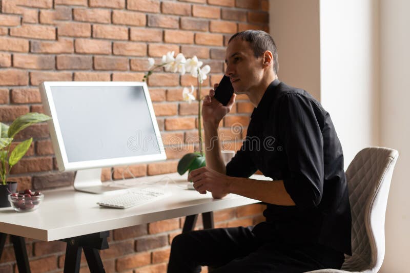 Focused Young Man Using Laptop, Typing on Keyboard, Writing Email or ...