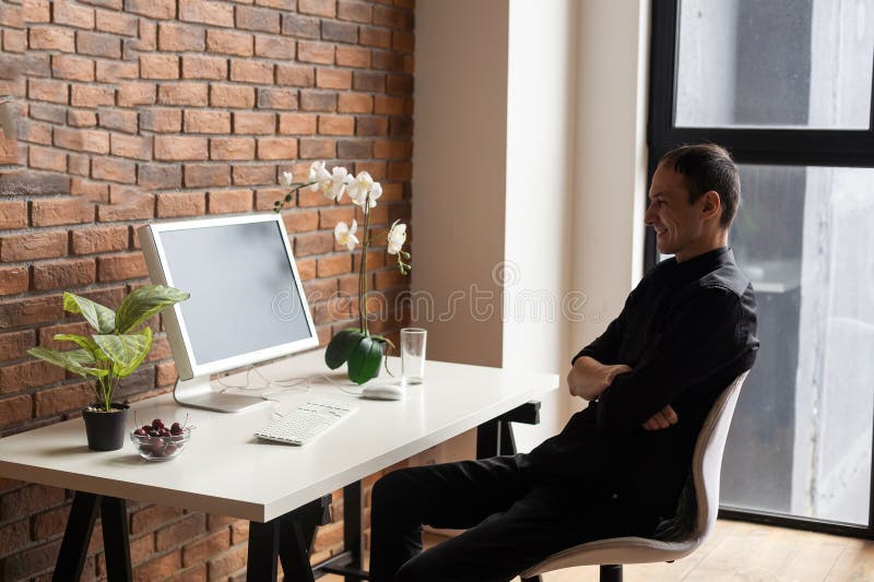 Focused Young Man Using Laptop, Typing on Keyboard, Writing Email or ...