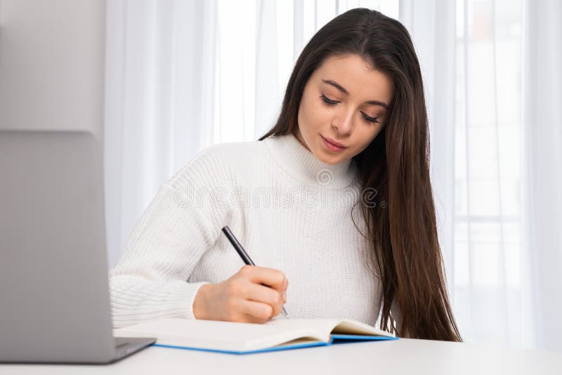 Focused Young Student Working on a Laptop, Preparing for an Exam and ...
