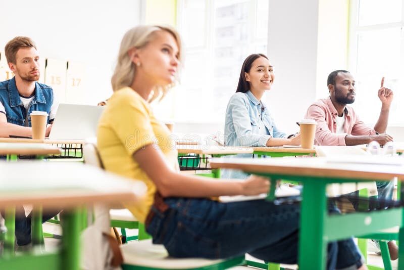 Focused Young Students Sitting in Classroom Stock Photo - Image of ...