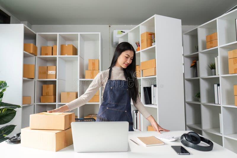 Focused Young Woman Managing Logistics in a Stylish Office, Organizing ...
