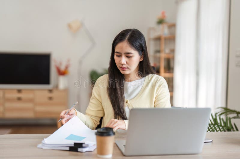 Focused Young Woman Reviewing Documents Working Laptop Cozy Home Office ...
