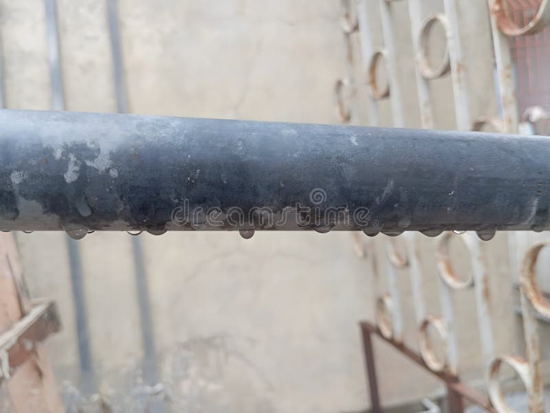 Focusing Camera on Pipe and Water Droplets on Pipe Stock Photo - Image ...