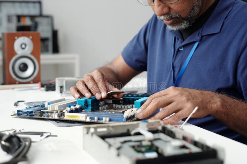 Focusing on Motherboard Assembly in Tech Workshop Stock Image - Image ...