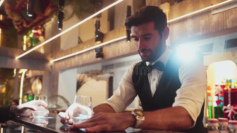 Focusing Smart Bartender Serving Gin Fizz or Tonic To Customer at Bar. Vinosity. Stock Footage ...