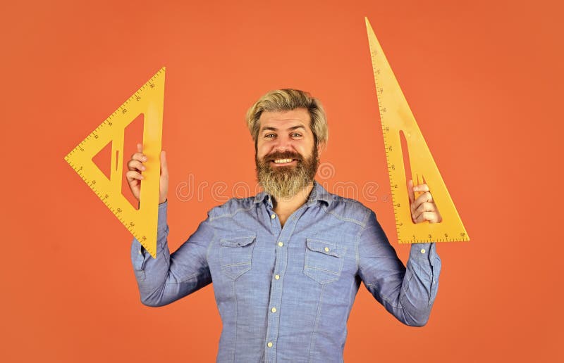 Focusing on Work. Education. School Teacher Use Triangle. Math and ...