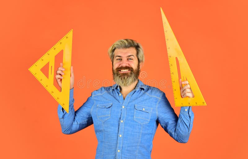 Focusing on Work. Education. School Teacher Use Triangle. Math and ...