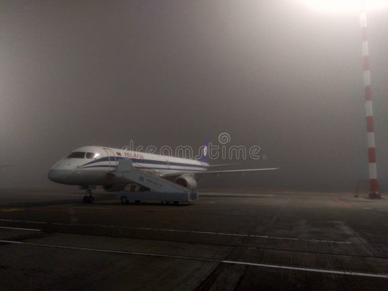 Plane in the fog editorial stock photo. Image of plane - 76786148