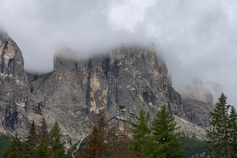 Fog Drapes the Dolomite Summits, Partially Obscuring the Steep Cliffs ...