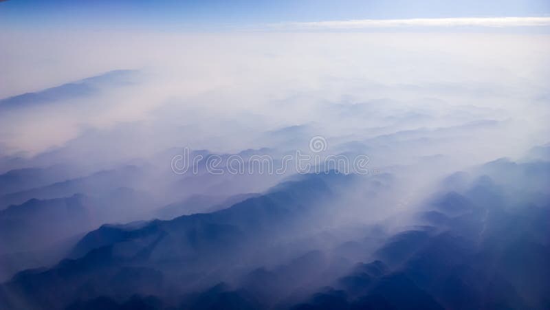 Fog enveloped the mountain stock image. Image of aerial - 57212249