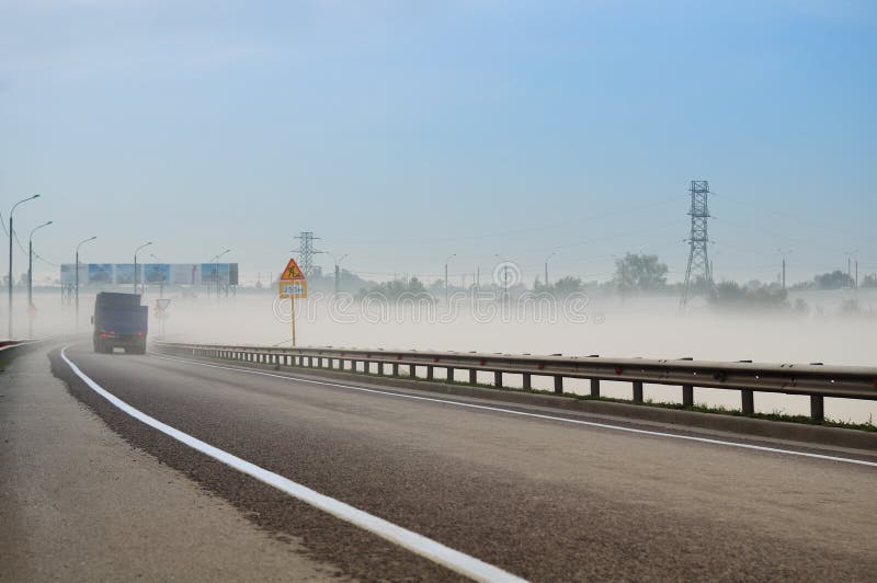 Fog on the highway stock photo. Image of cold, foggy - 144162446