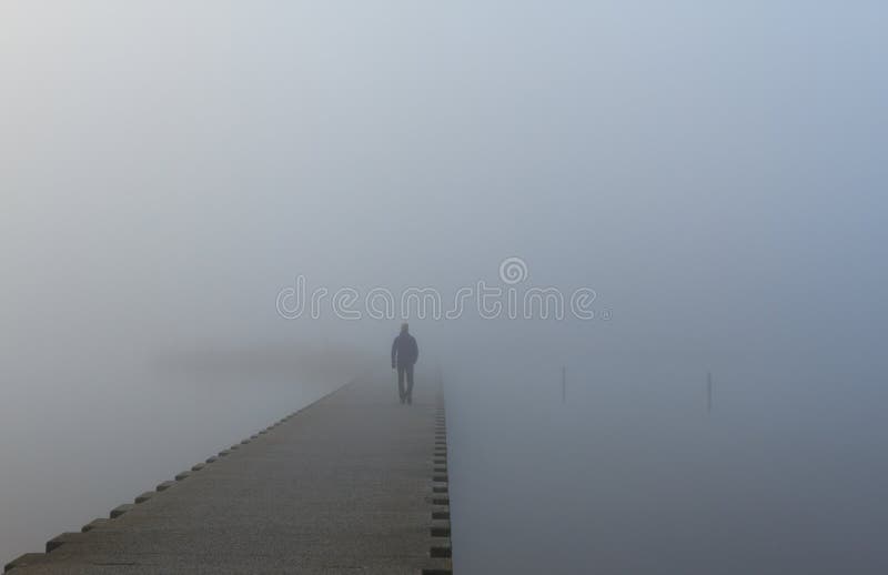 Man walking fog 1 stock image. Image of countryside, walking - 54221079
