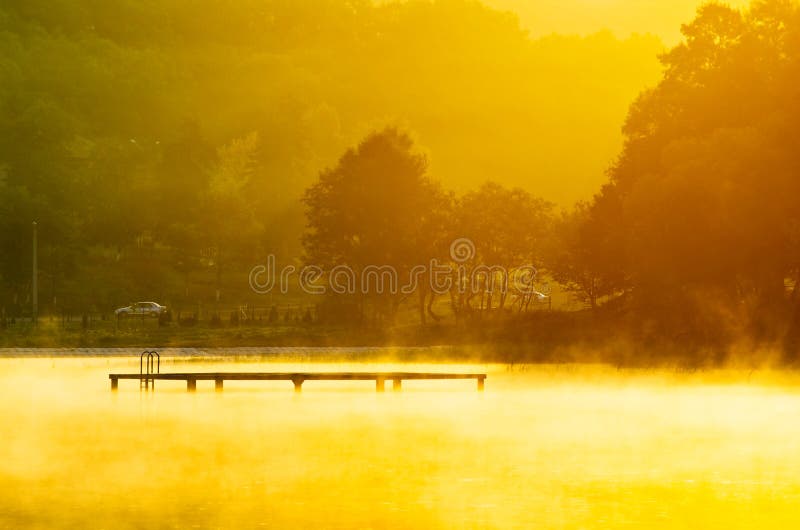 Fog over lake stock photo. Image of reflection, color - 24326086