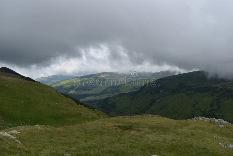 Fog over the mountains stock photo. Image of grass, landscape - 191707540