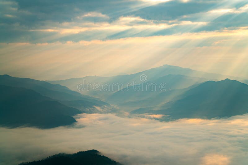 Fog Over the Valley Mountain in Morning Lights Stock Photo - Image of ...