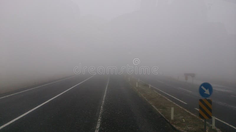 Fog on the road stock image. Image of road, weather, sign - 49241189