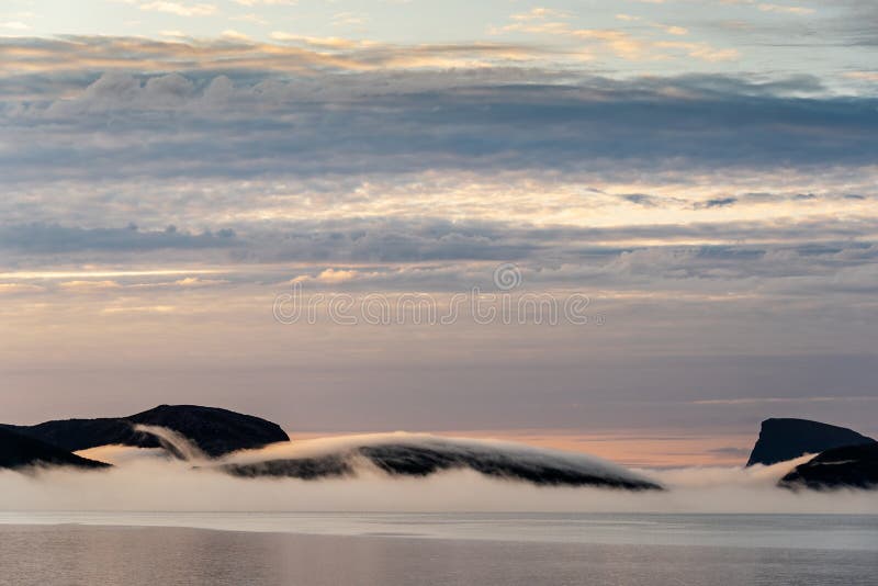 Fog rolling in stock image. Image of dawn, fjord, landscape - 140906301