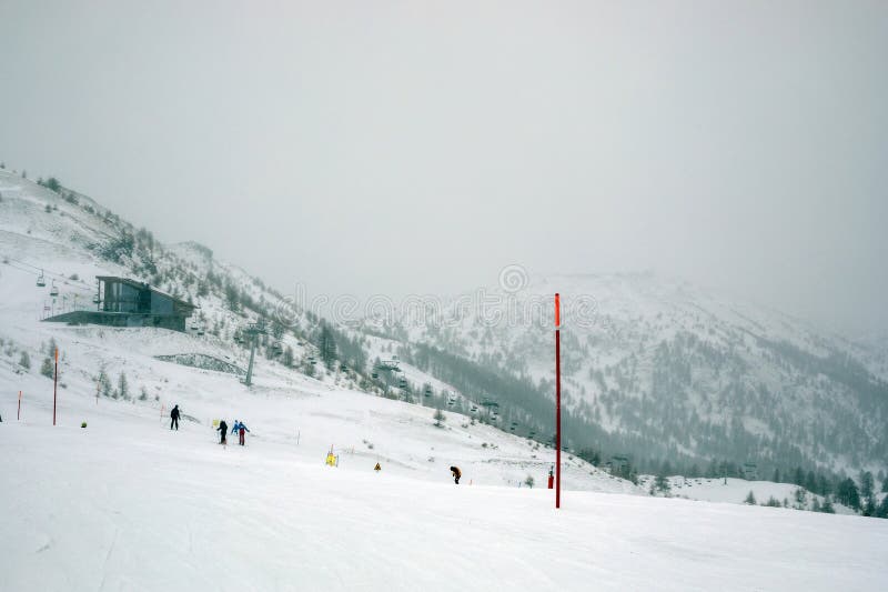 Fog and Snow on the Top of a Ski Slope with Reflective Signs. Stock ...
