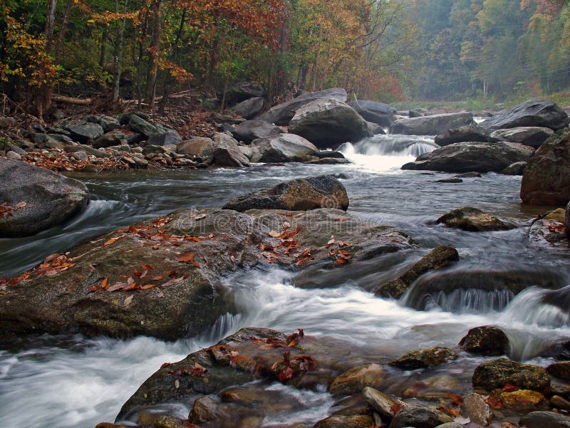 Foggy Fall River Scene stock image. Image of river, bolders - 49899