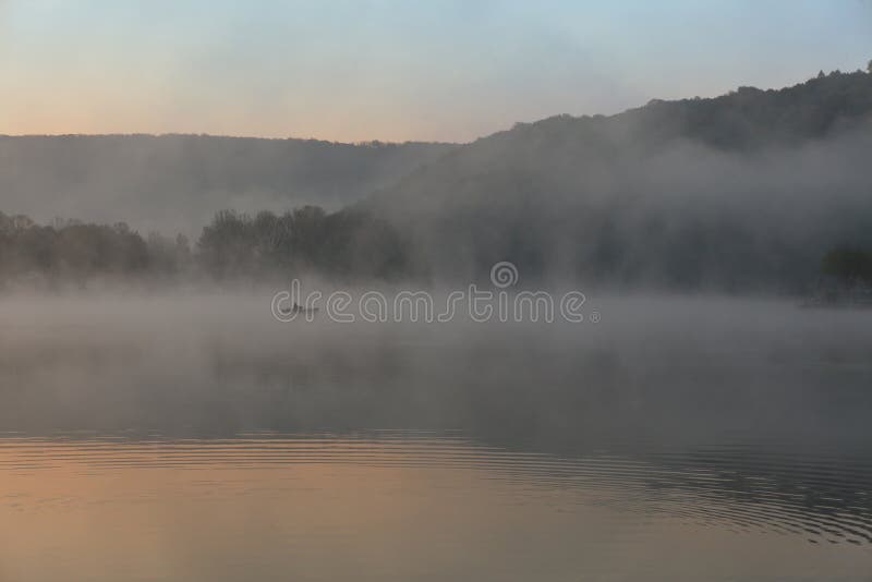 Foggy lake at sunrise stock photo. Image of haze, misty - 42490982