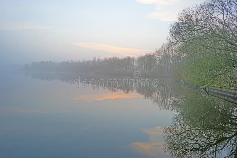 Foggy lake at sunrise stock photo. Image of haze, rural - 78131680
