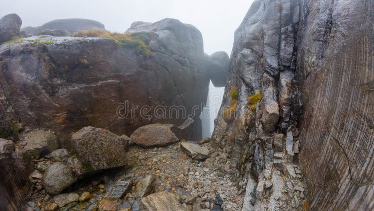 Foggy Mountain with Boulder between Cliffs Stock Photo - Image of ...