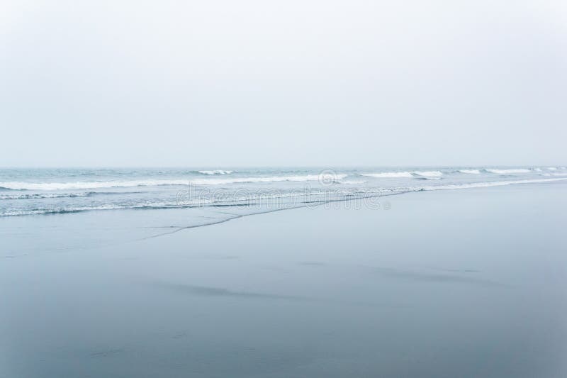 Foggy Seascape, Cold Ocean Shore with a Wide Beach Stock Photo - Image ...