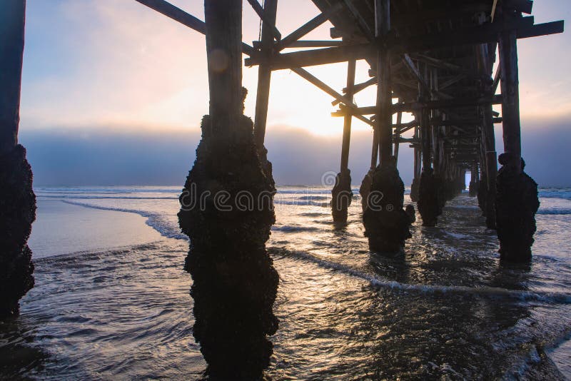 Foggy sunset on the coast stock image. Image of coastal - 266055461