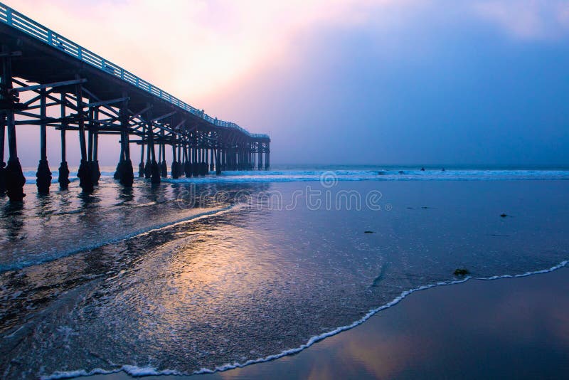 Foggy sunset on the coast stock photo. Image of water - 266055486