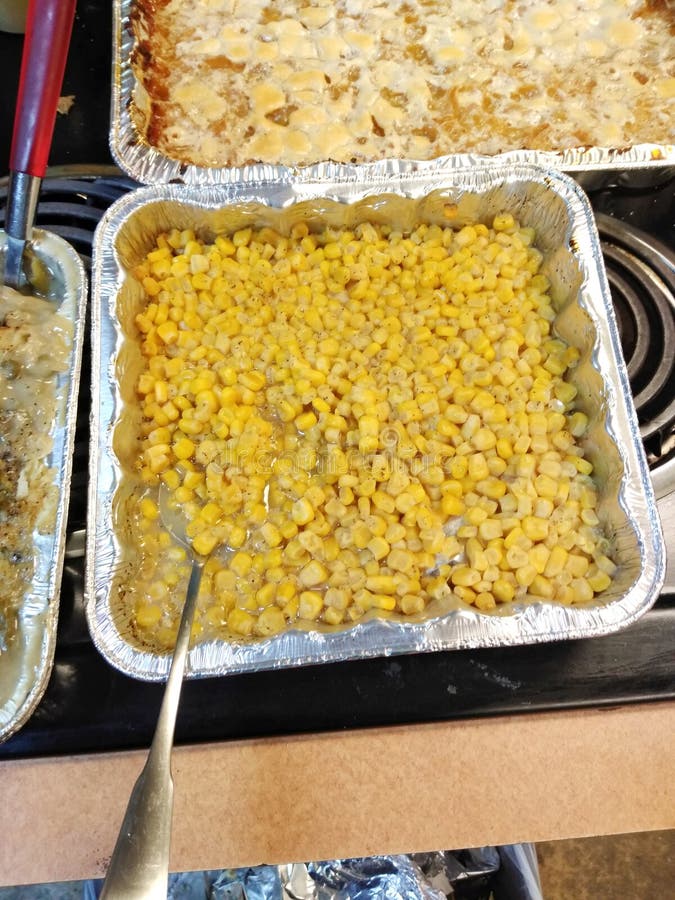 A Foil Pan of Corn at a Potluck Dinner Stock Photo - Image of baking ...