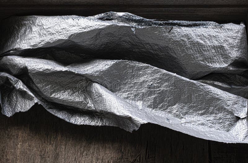 Silver Metallic Tarp Fabric on Wood Table Stock Image - Image of alloy ...