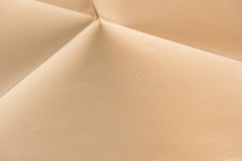 Folded biege color paper stock image. Image of fold - 109543307