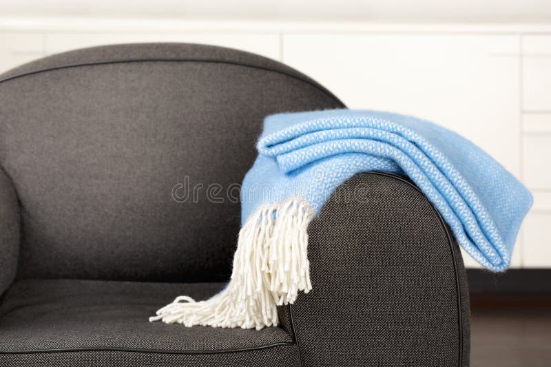 Folded Blanket Made of Wool on a Sofa or Upholstered Chair Stock Photo ...