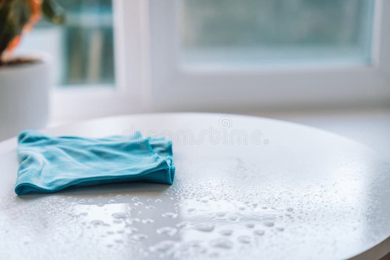 Folded Blue Microfiber Cloth Lying on a Freshly Cleaned White Tabletop ...