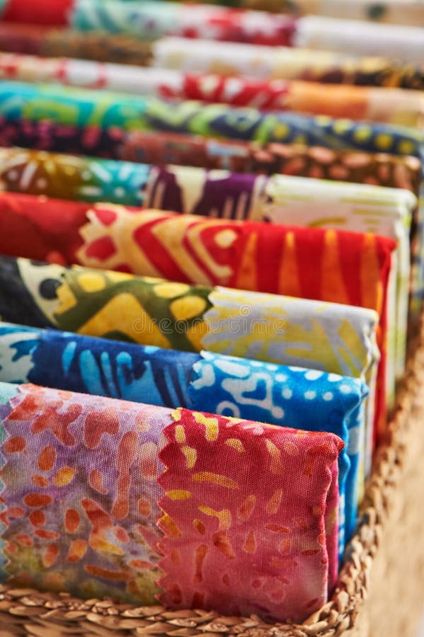 Folded Bright Pieces of Quilting Batik Fabrics in a Basket, Macro Stock ...