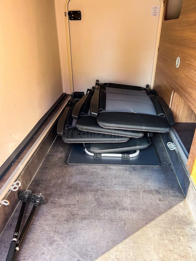 Folded Camping Chairs and Trekking Poles are Neatly Organized Inside ...