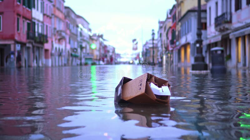 Folded Carton Boxes Float on Flood Water Surface in Street Stock ...