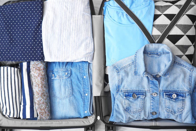 Folded Clothes in Open Suitcase, Top View Stock Photo - Image of ...