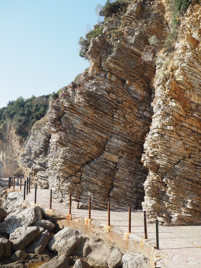 Folded Coastal Rocks on the Seashore Stock Image - Image of seashore ...