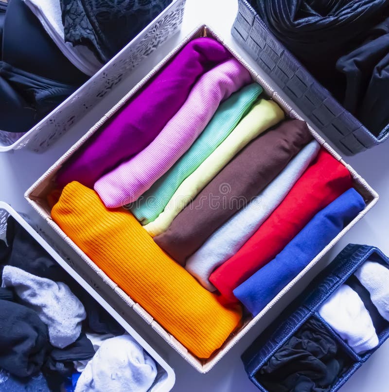 Folded Colorful Clothes in a Box. Home Organizing. Domestic Vertical ...