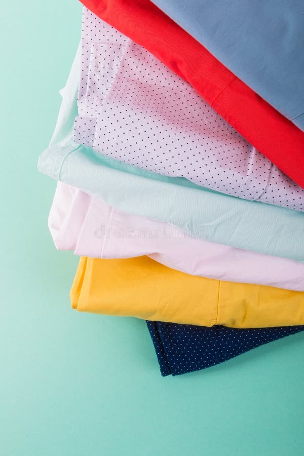 Folded Colorful Pants and Jeans. Stack of Bright Female Trousers. Close ...