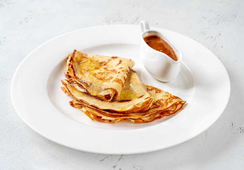 Folded crepes on the plate stock photo. Image of delicious - 210149238