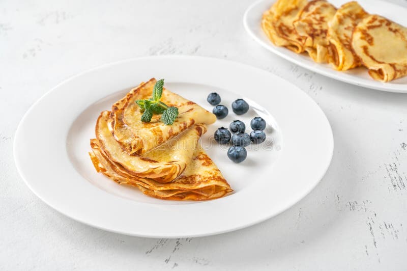 Folded crepes on the plate stock photo. Image of european - 210149242