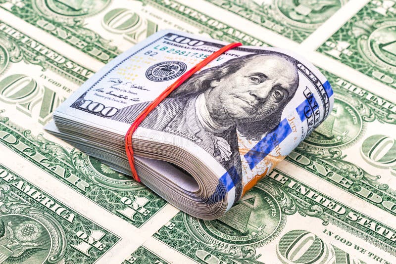 Folded Dollar Bills Wrapped by Rubber Band Over Dollars Stock Photo ...