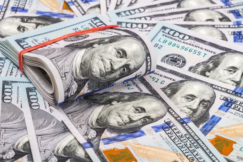 Folded Dollar Bills Wrapped by Rubber Band Over Dollars Stock Image ...