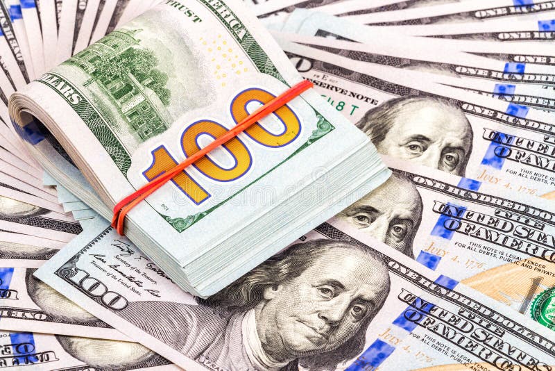 Folded Dollar Bills Wrapped by Rubber Band Over Dollars Stock Photo ...