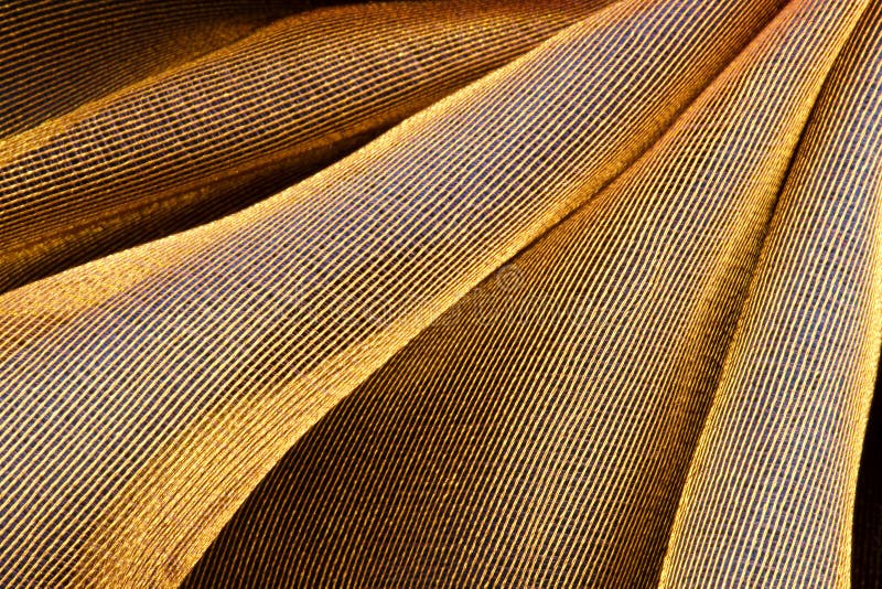 Folded golden fabric stock photo. Image of textiles, colourful - 41340114