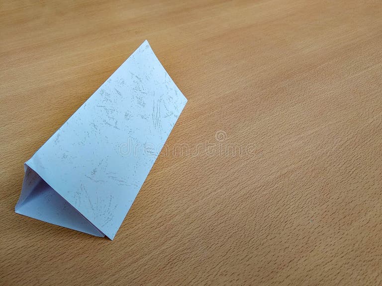 Folded Paper for Nameplate on Table Stock Image - Image of paper, table ...