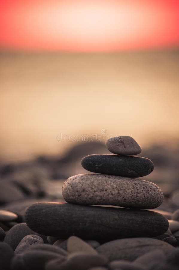 Stack of Zen Stones on Pebble Beach Stock Photo - Image of black ...