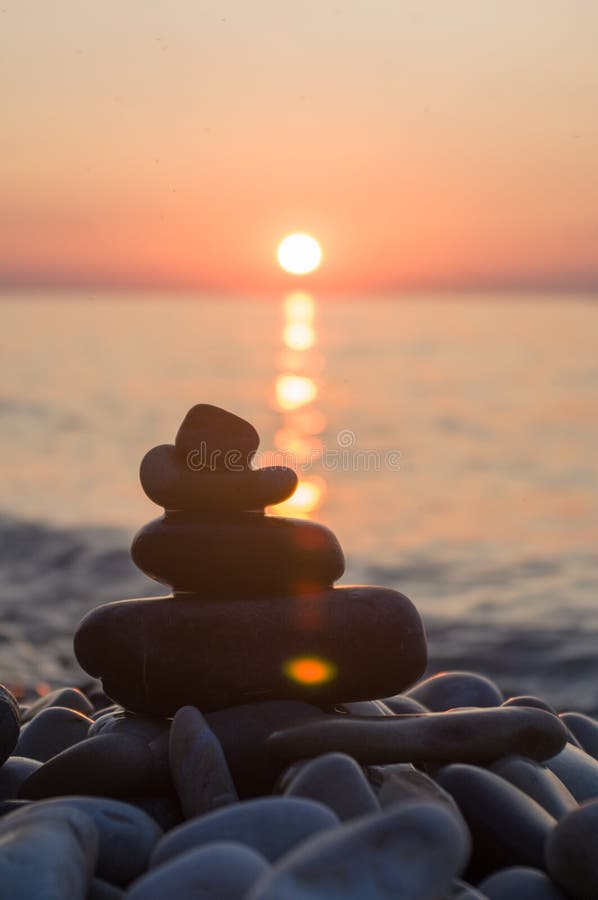 Stack of Zen Stones on Pebble Beach Stock Photo - Image of black ...